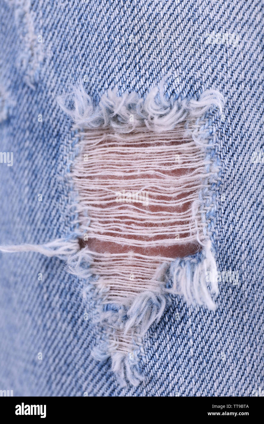 Torn jeans, closeup Stock Photo - Alamy
