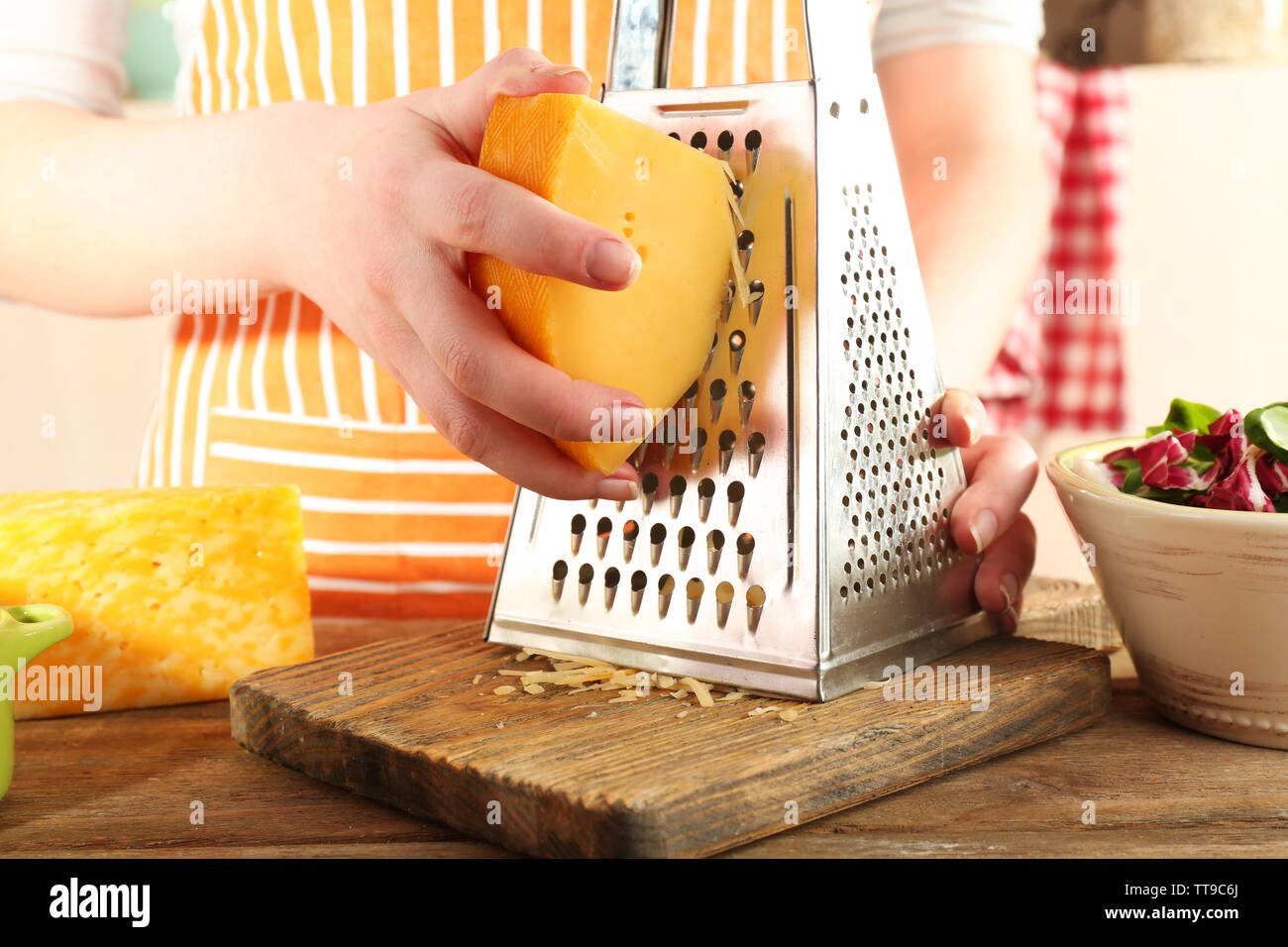 Hand grating yellow cheese metal hi-res stock photography and images - Alamy