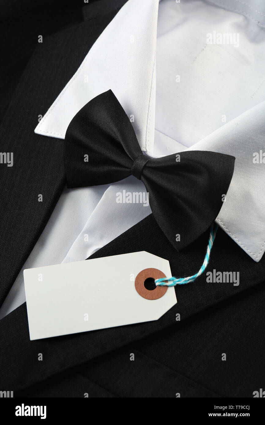 Price tag on white shirt and black jacket, close-up Stock Photo - Alamy