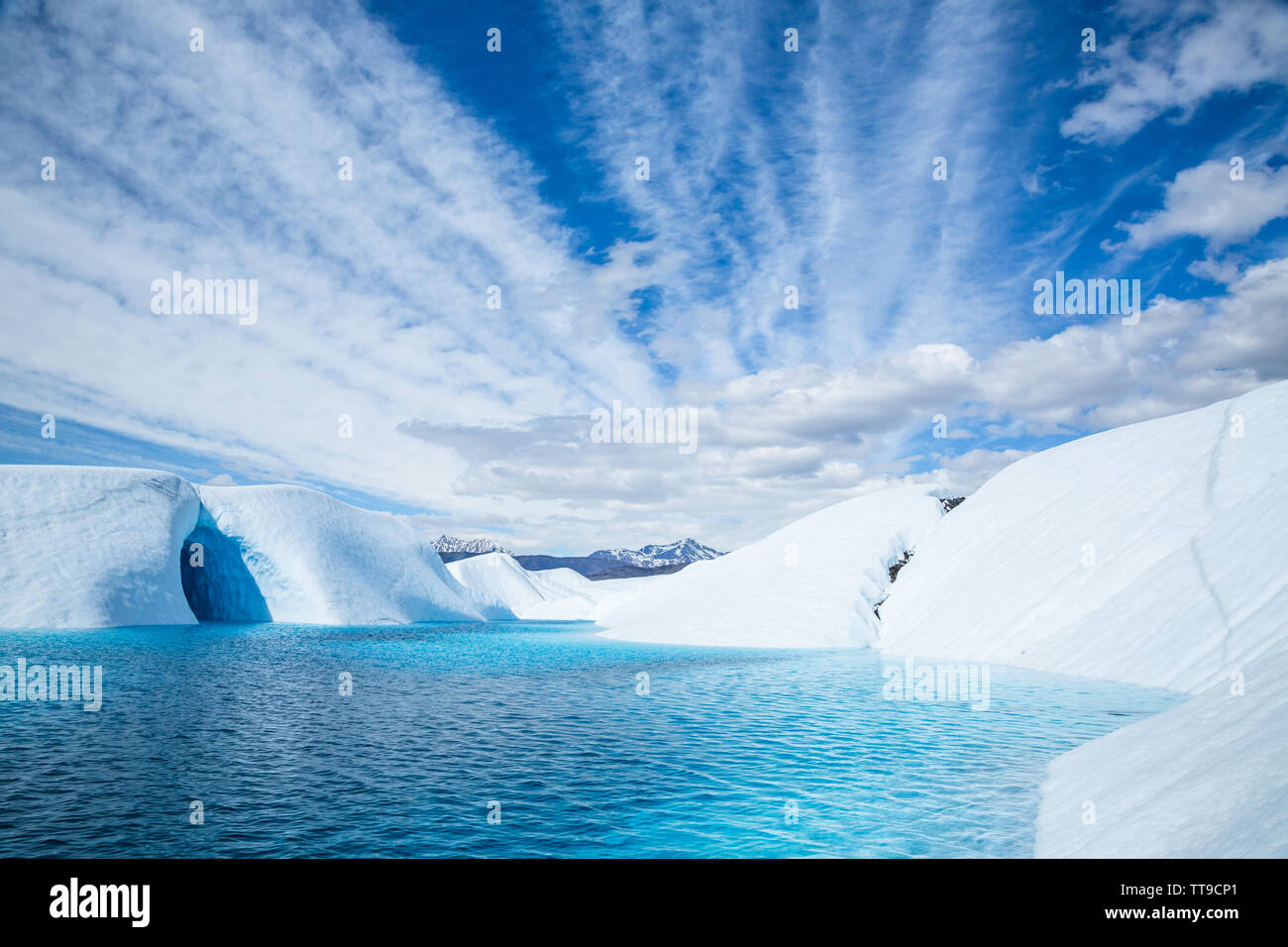 Ice cave flooded by deep blue glacier pool in the Matanuska Glacier ...