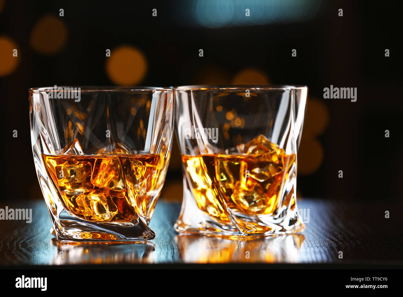 Glasses of whiskey on bar background Stock Photo - Alamy