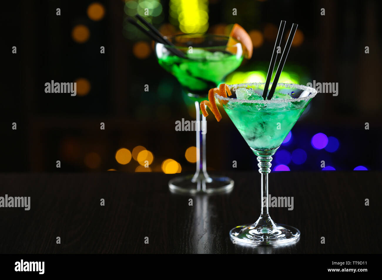Glasses of cocktails on bar background Stock Photo - Alamy