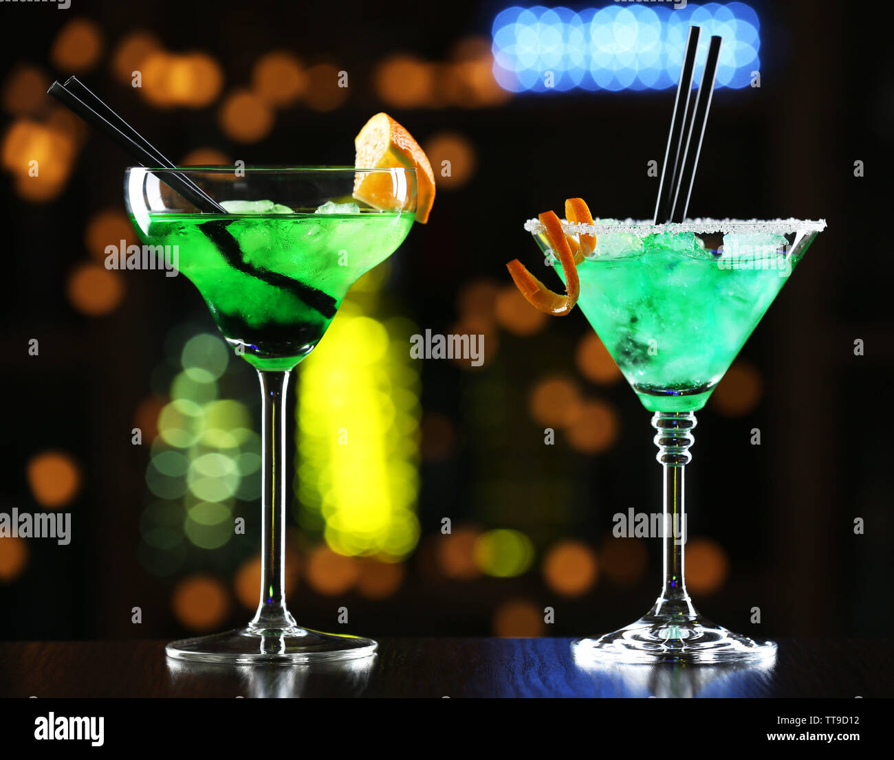 Glasses of cocktails on bar background Stock Photo - Alamy