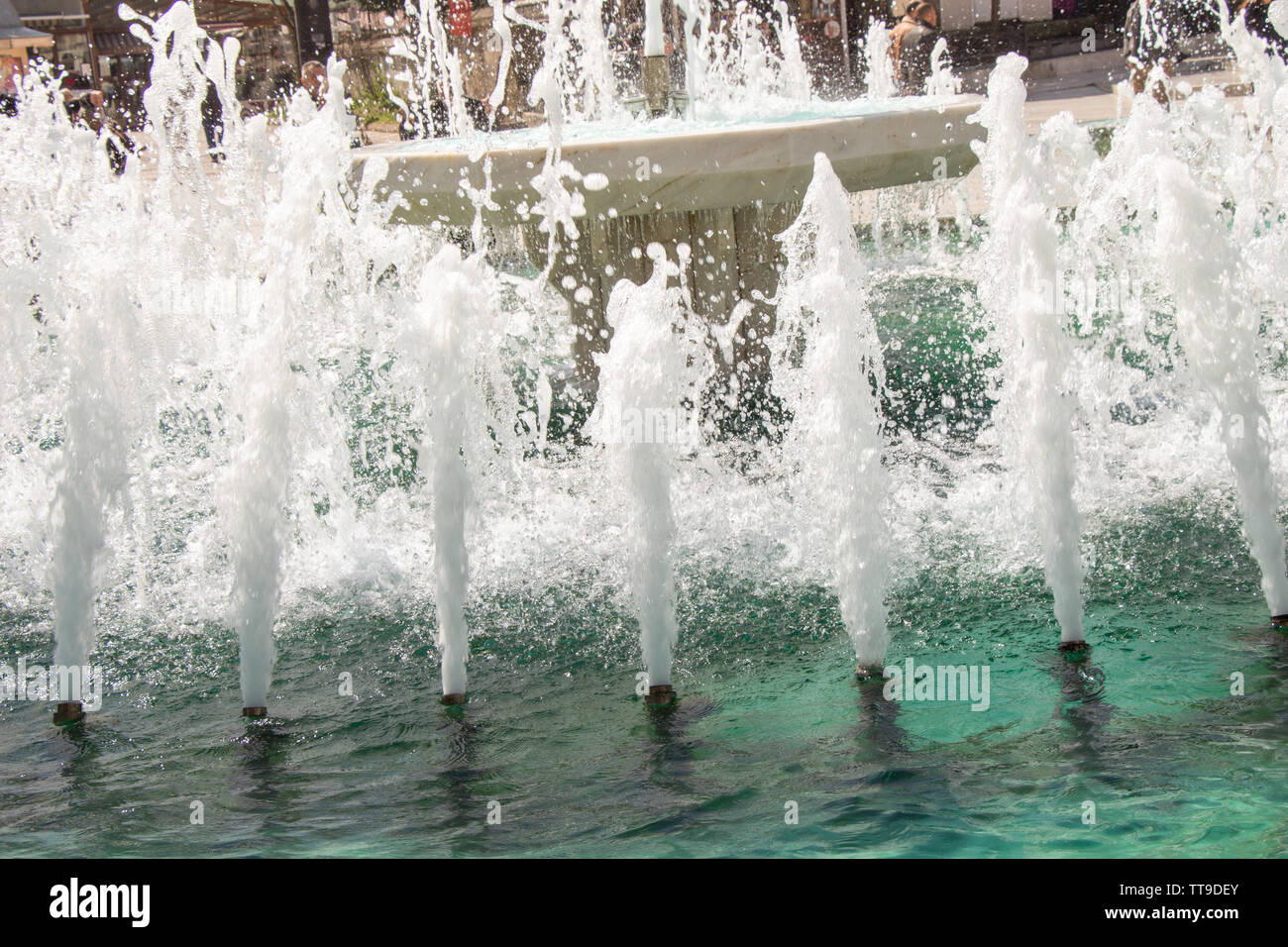 A water fountain sprinkling water in the view Stock Photo - Alamy