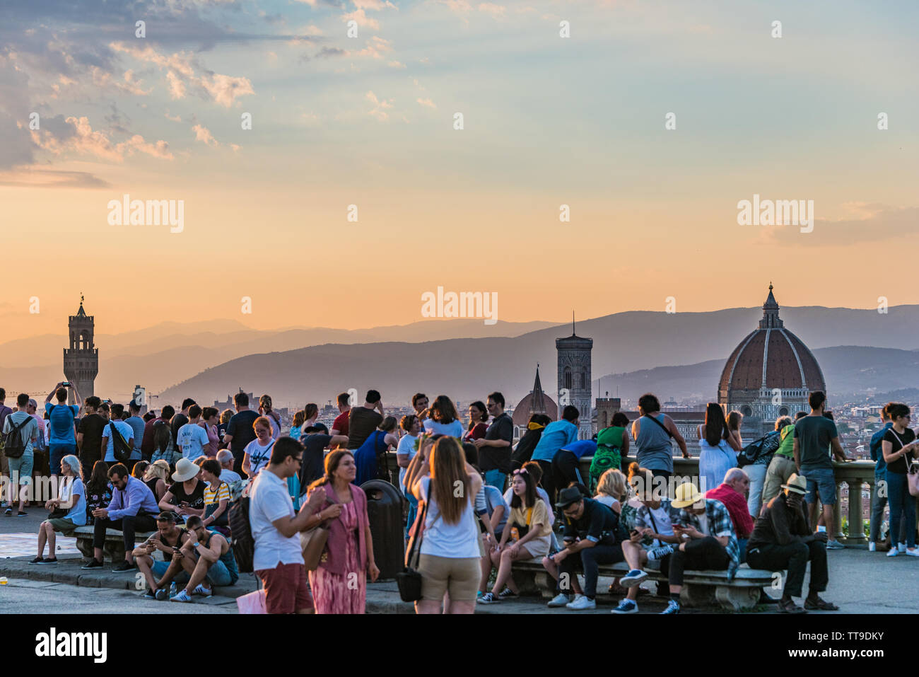 People watching Florence panorama during summer sunset from Piazzale ...
