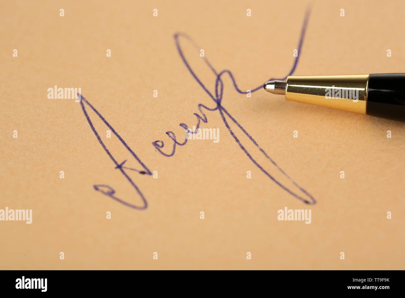 Pen and signature on paper background Stock Photo - Alamy