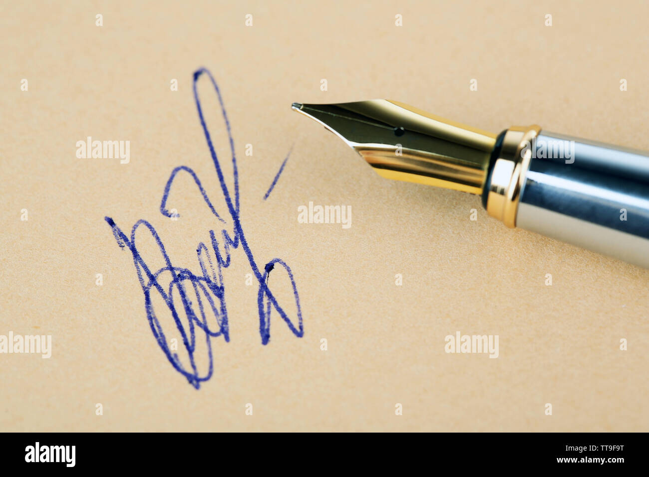 Pen and signature on paper background Stock Photo - Alamy