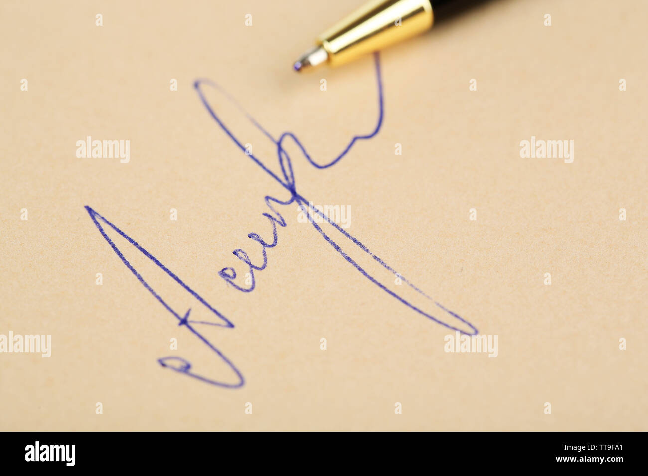 Pen and signature on paper background Stock Photo - Alamy