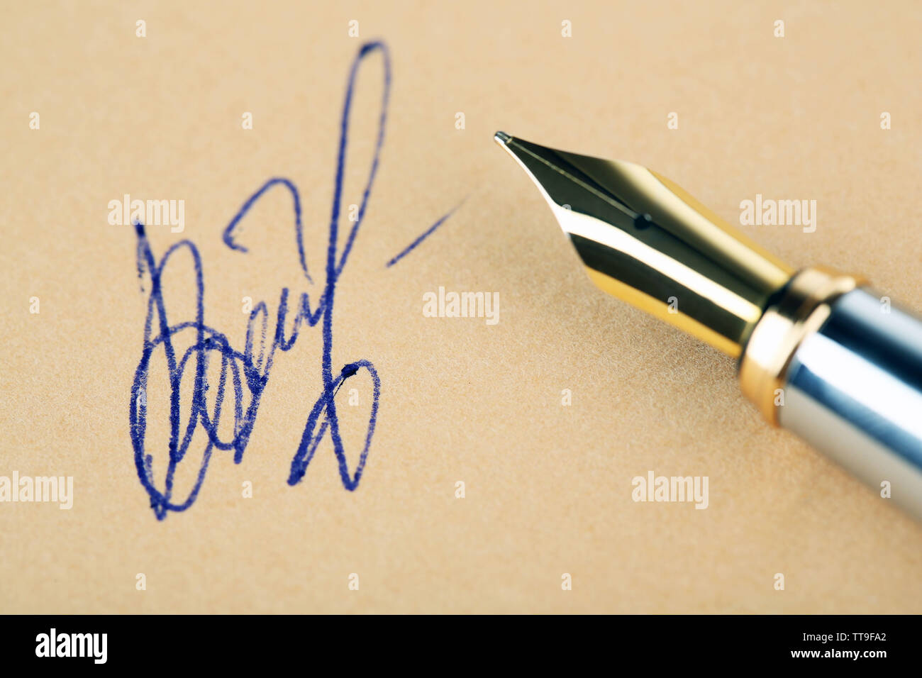 Pen and signature on paper background Stock Photo - Alamy