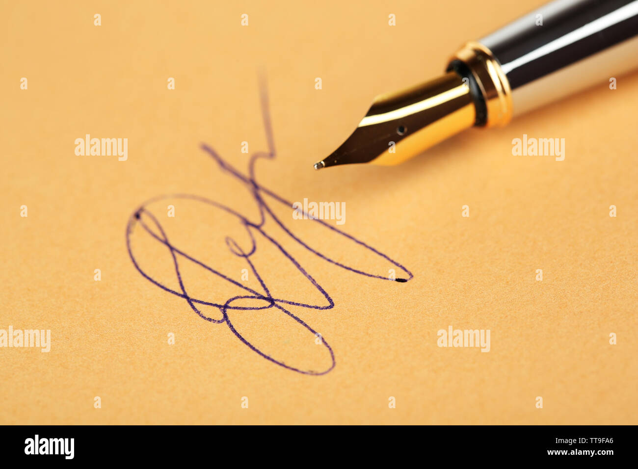 Pen and signature on paper background Stock Photo - Alamy