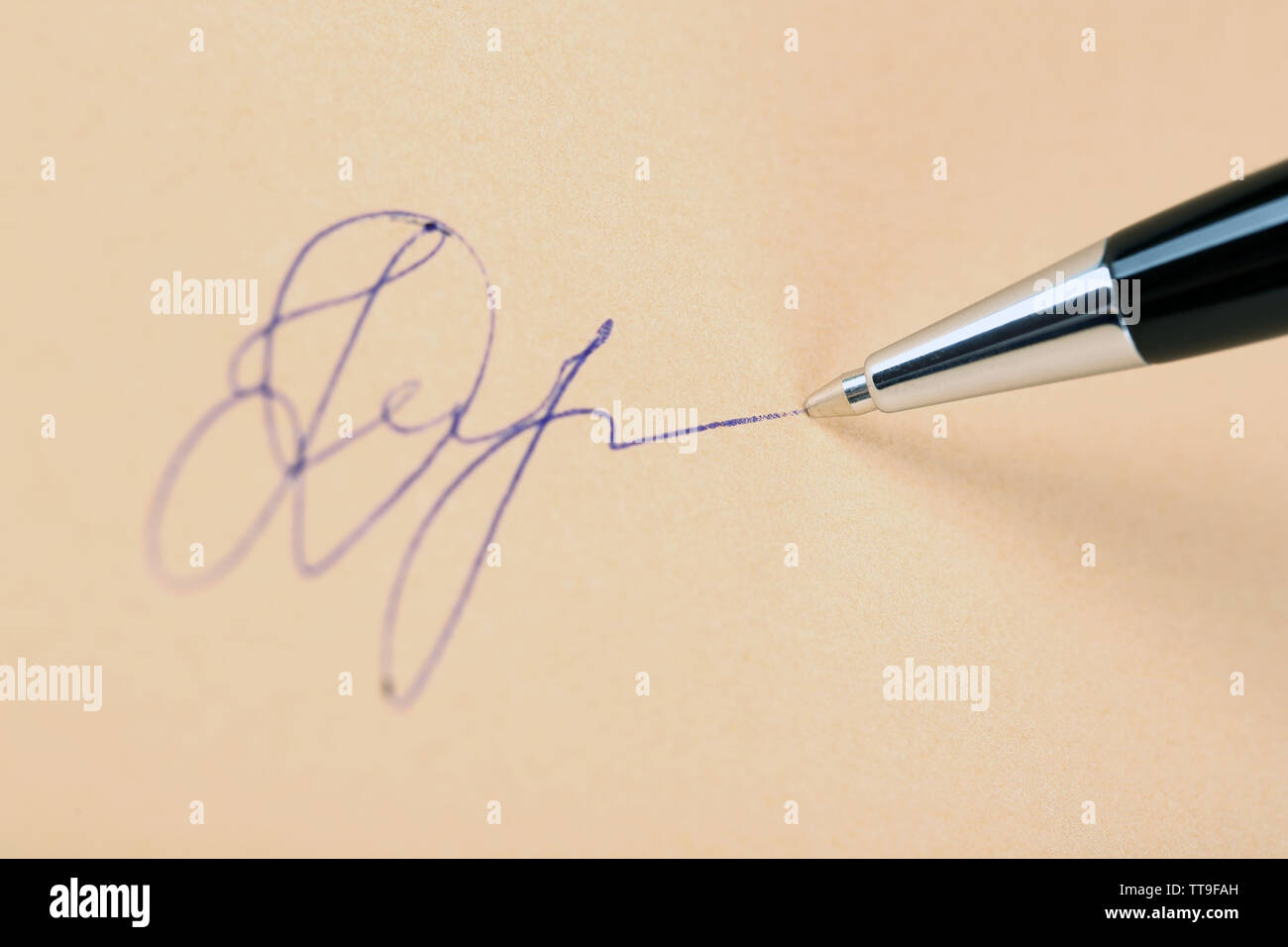 Pen and signature on paper background Stock Photo - Alamy