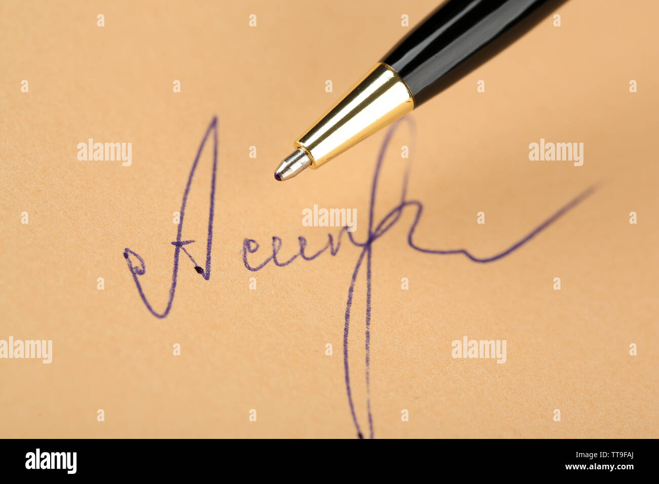 Pen and signature on paper background Stock Photo - Alamy