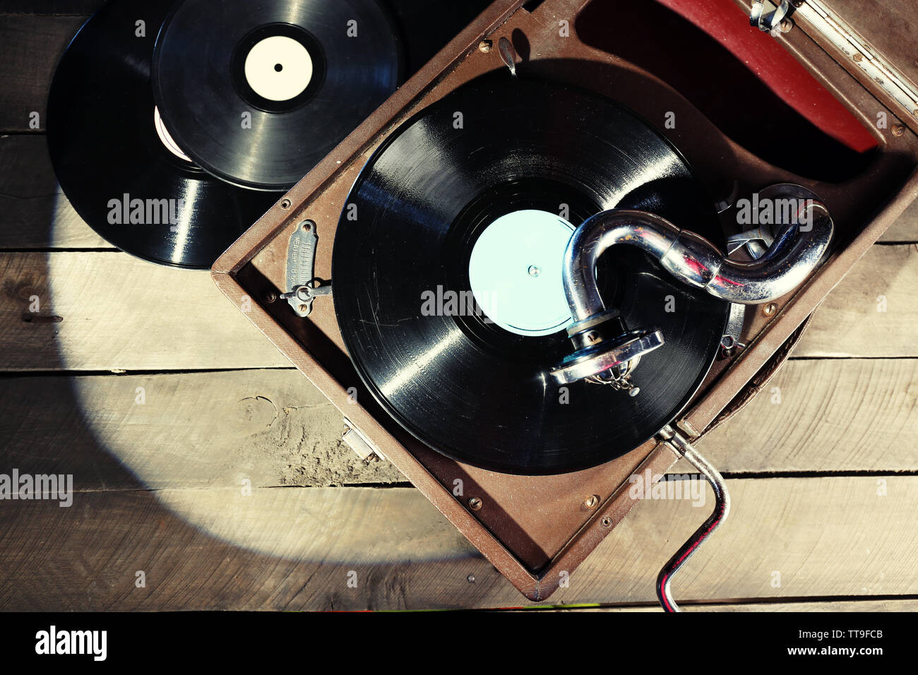 Gramophone with vinyl record on wooden table, top view Stock Photo - Alamy