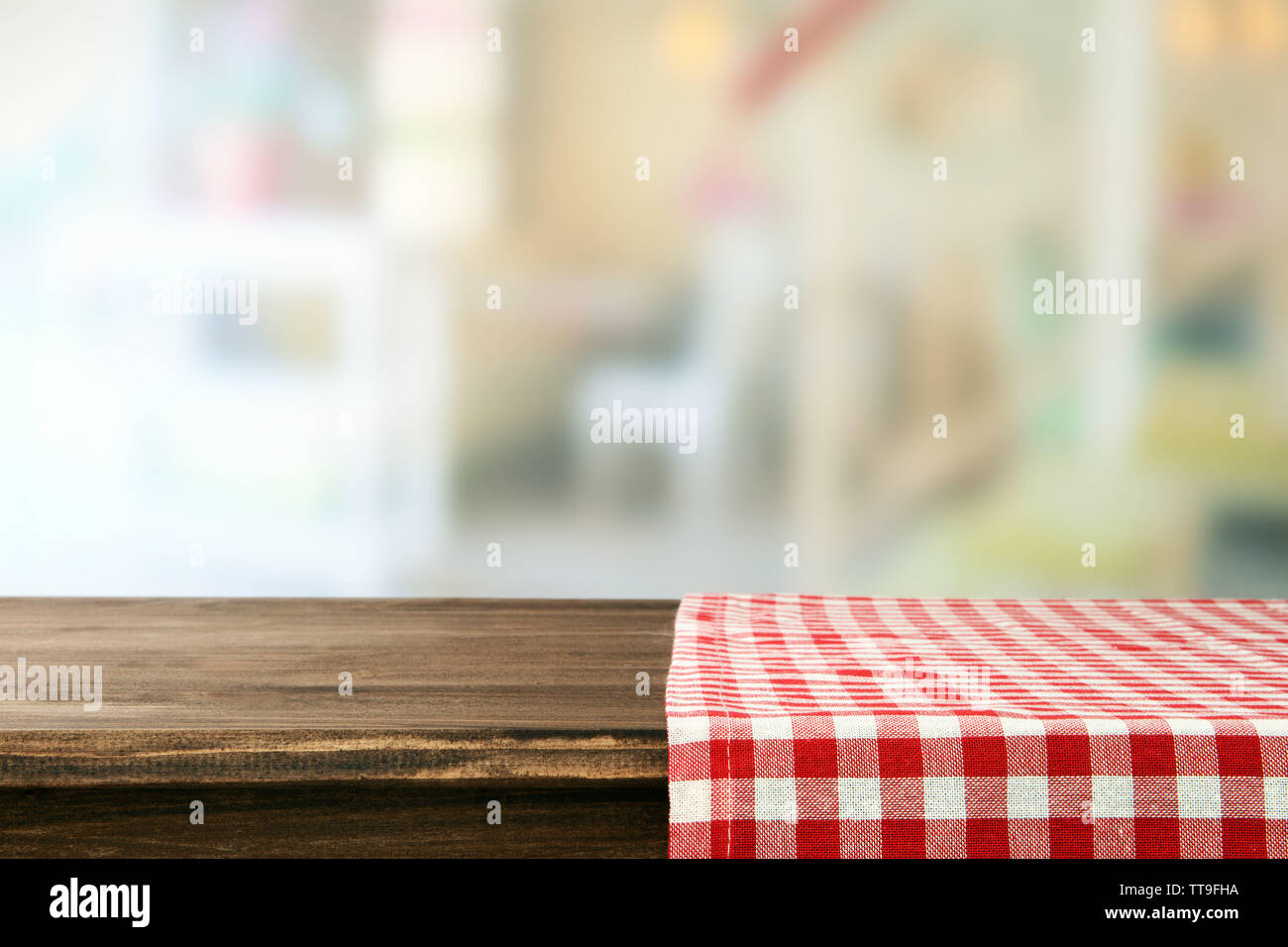 Empty wooden table with napkin and light background Stock Photo - Alamy