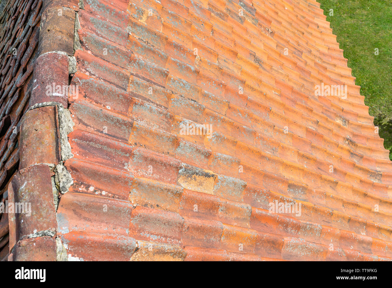 A red ceramic roof tile placed on an old building, photos taken up ...