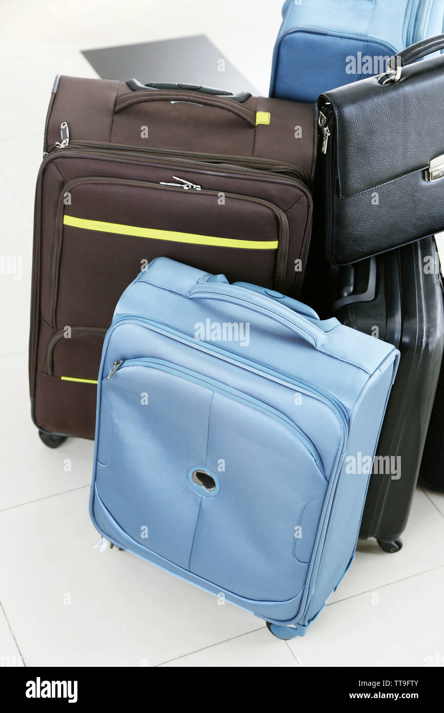 Group of suitcases on floor background Stock Photo - Alamy
