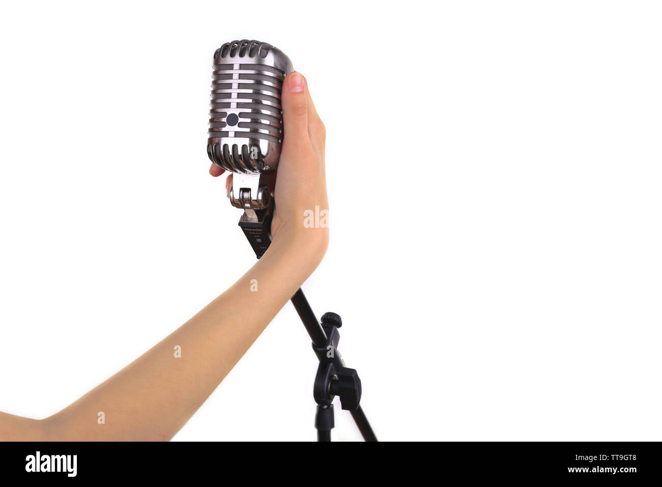 Retro microphone in female hand isolated on white Stock Photo - Alamy