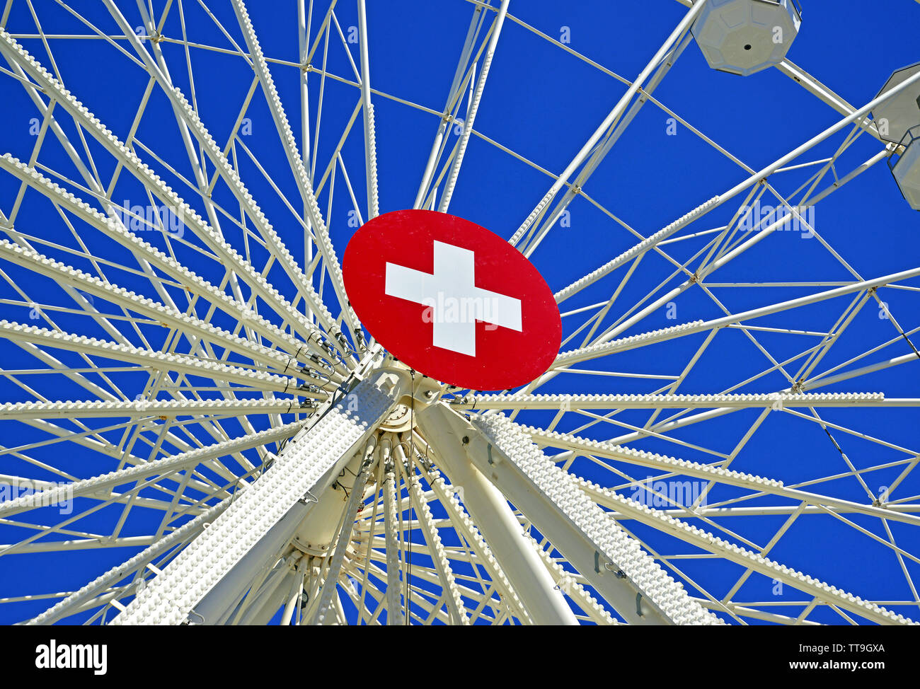 Swiss flag on white Ferris wheel, Geneva Switzerland Stock Photo - Alamy