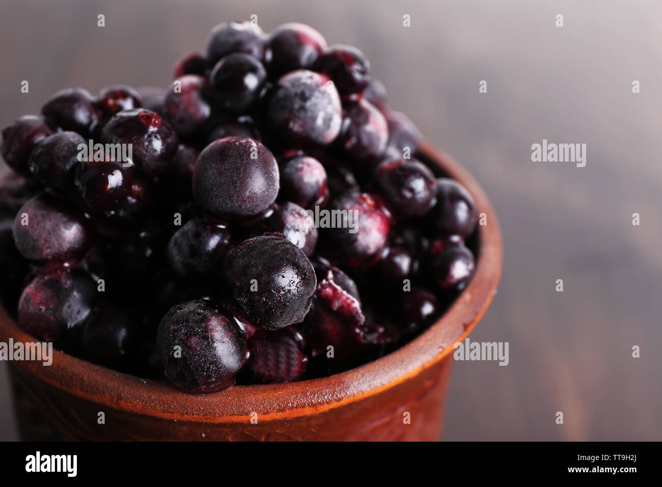 Cup of frozen currant berries, closeup Stock Photo - Alamy