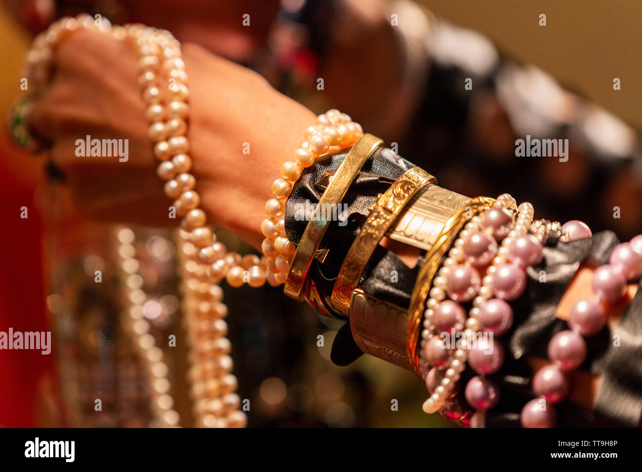 Female Hand Arranging Jewellery Stock Photo - Alamy