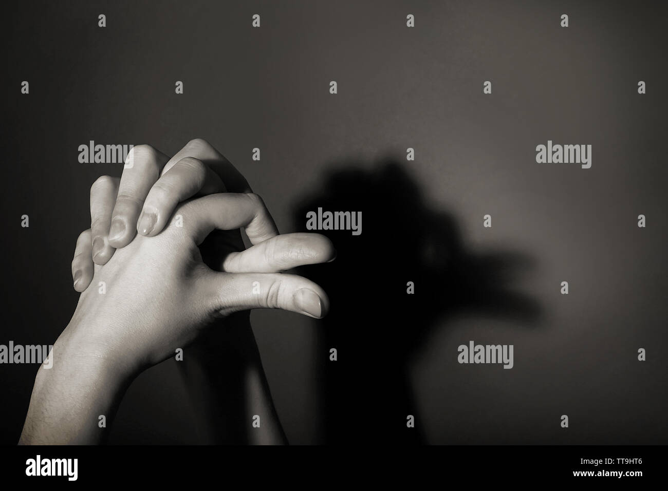 Hands gesture like turkey on gray background Stock Photo - Alamy