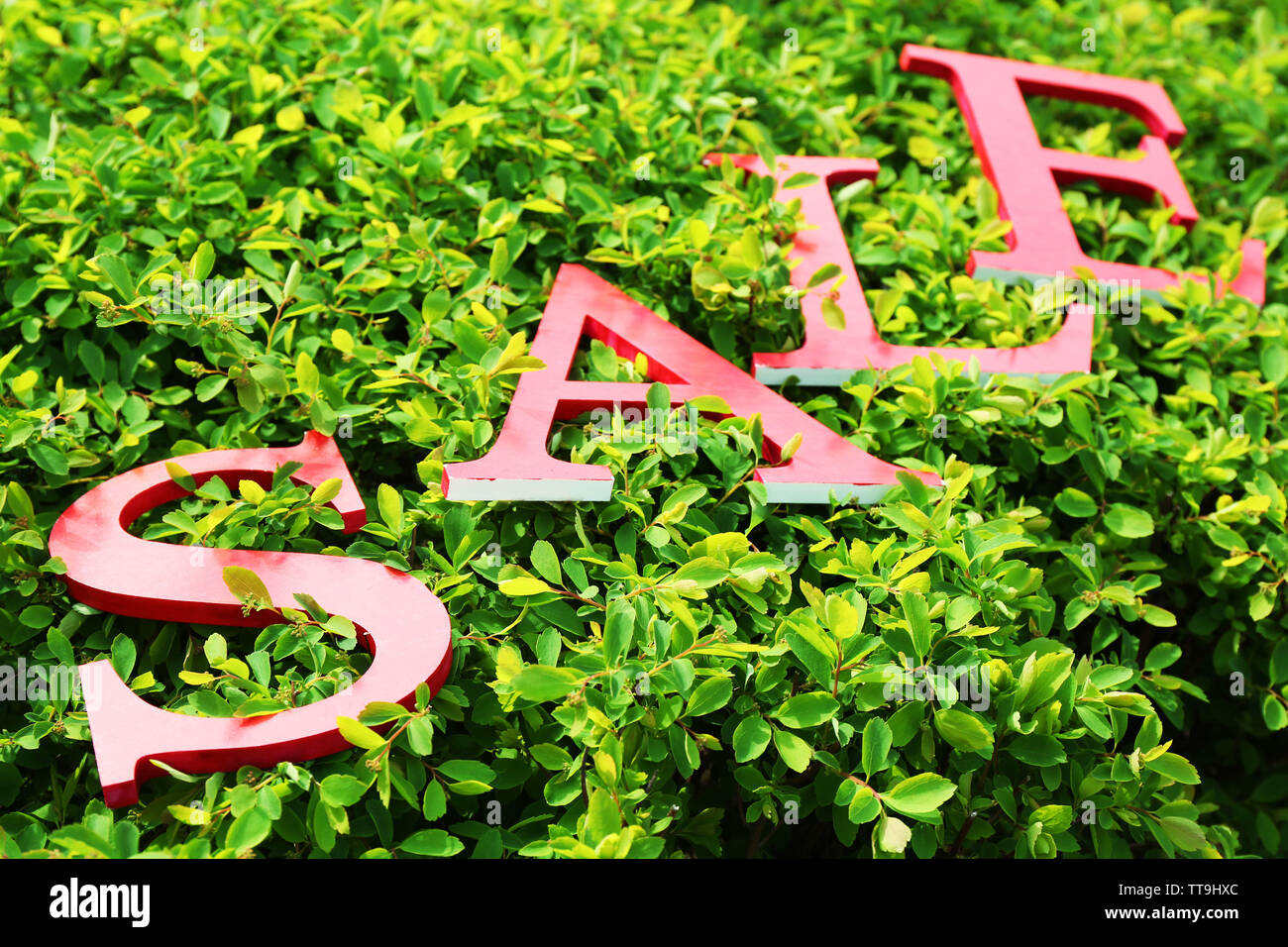 Sale on green background Stock Photo - Alamy