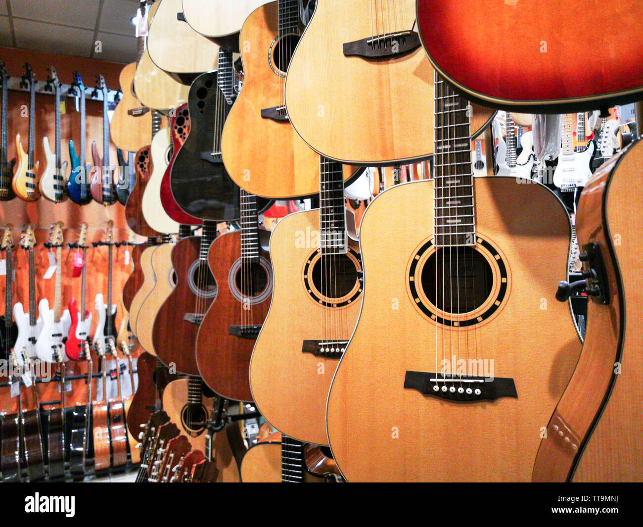Guitars hanging on walls hi-res stock photography and images - Alamy