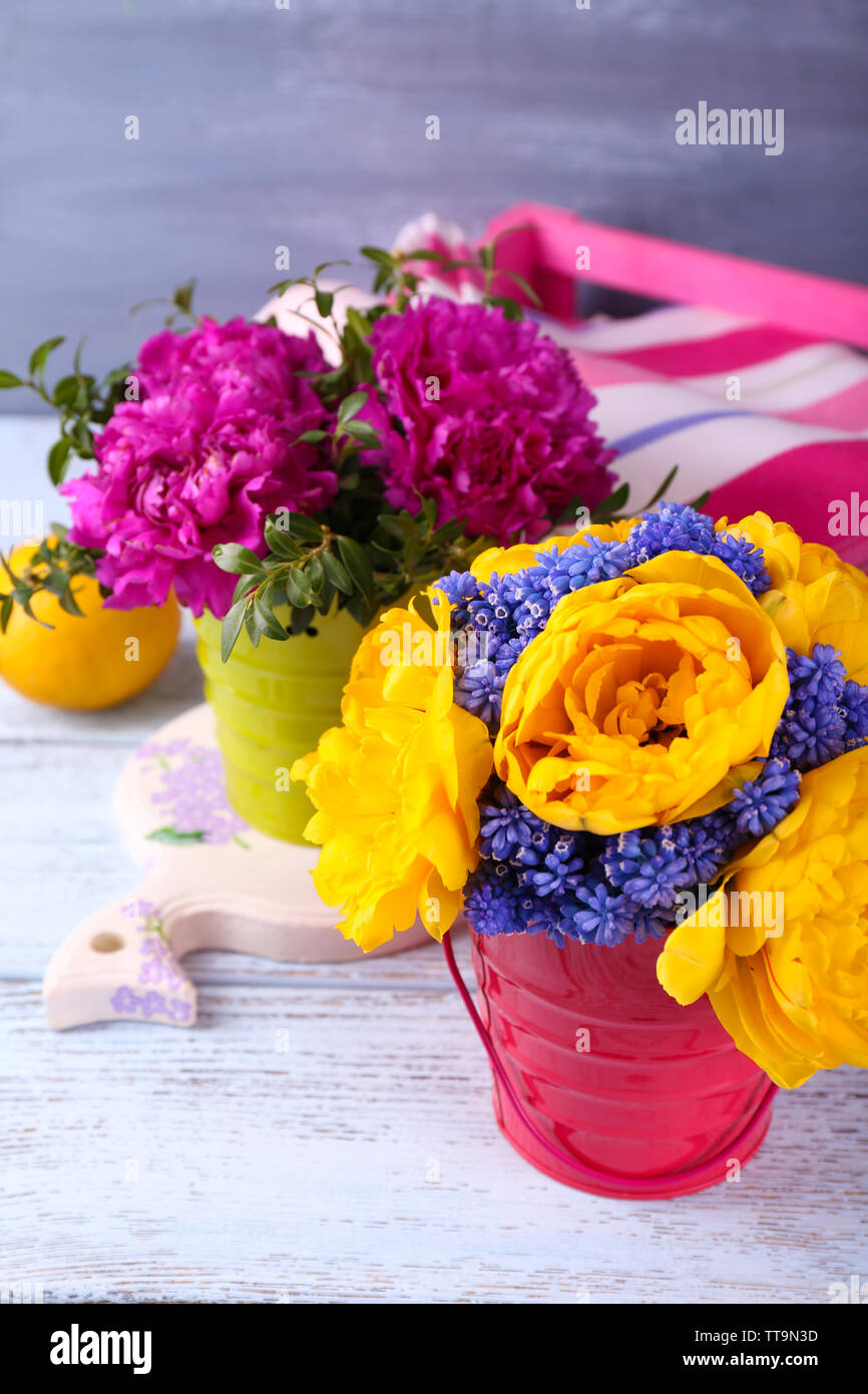 Composition with fresh spring flowers on wooden background Stock Photo ...