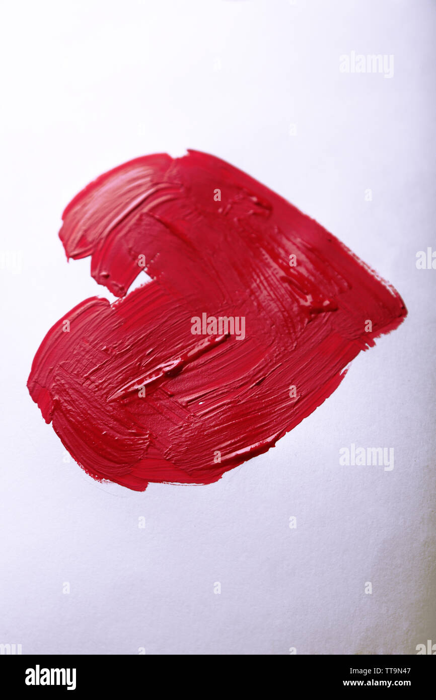 Painted red heart on white paper background Stock Photo - Alamy