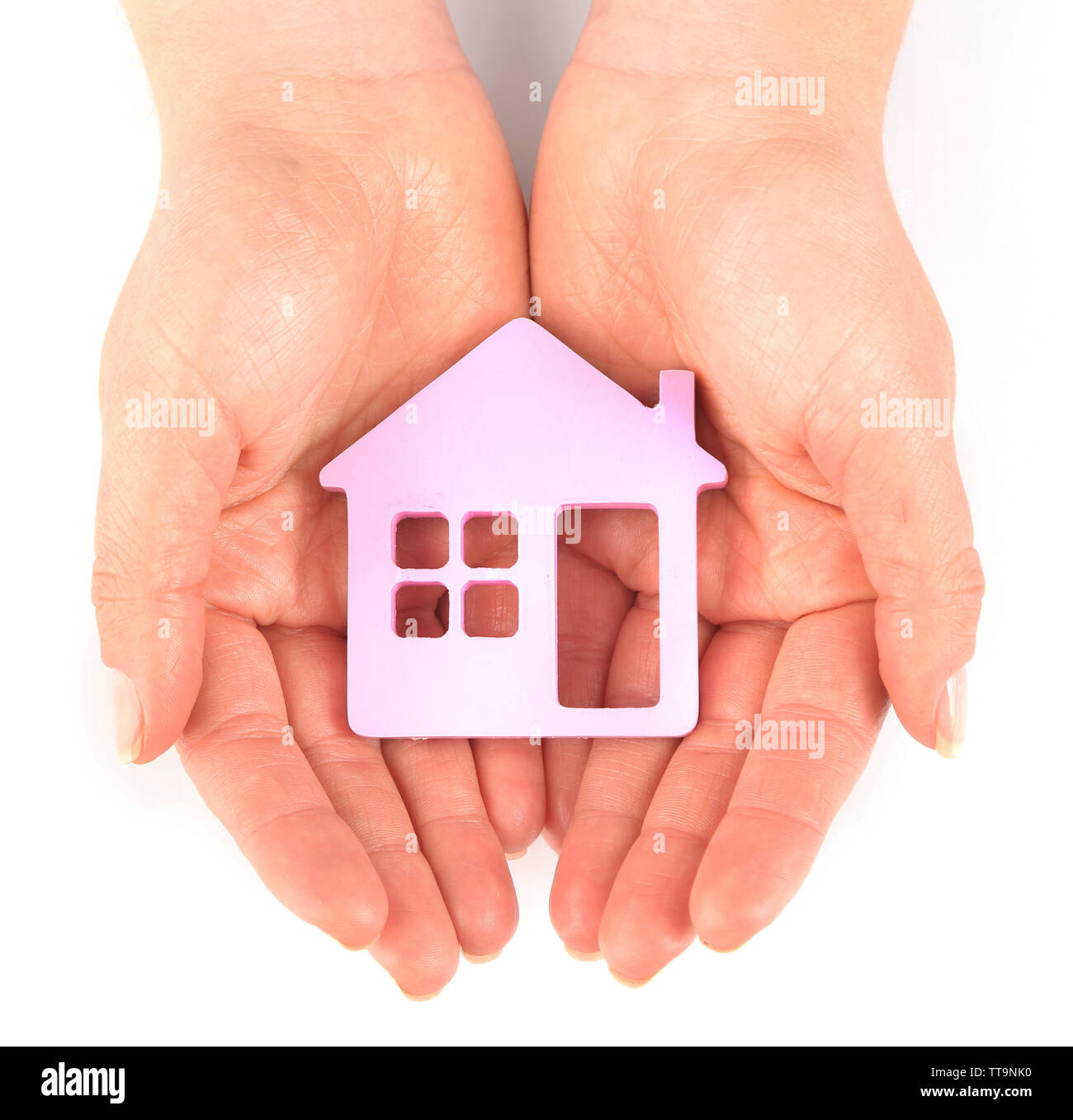 Female hands with model of house isolated on white Stock Photo - Alamy