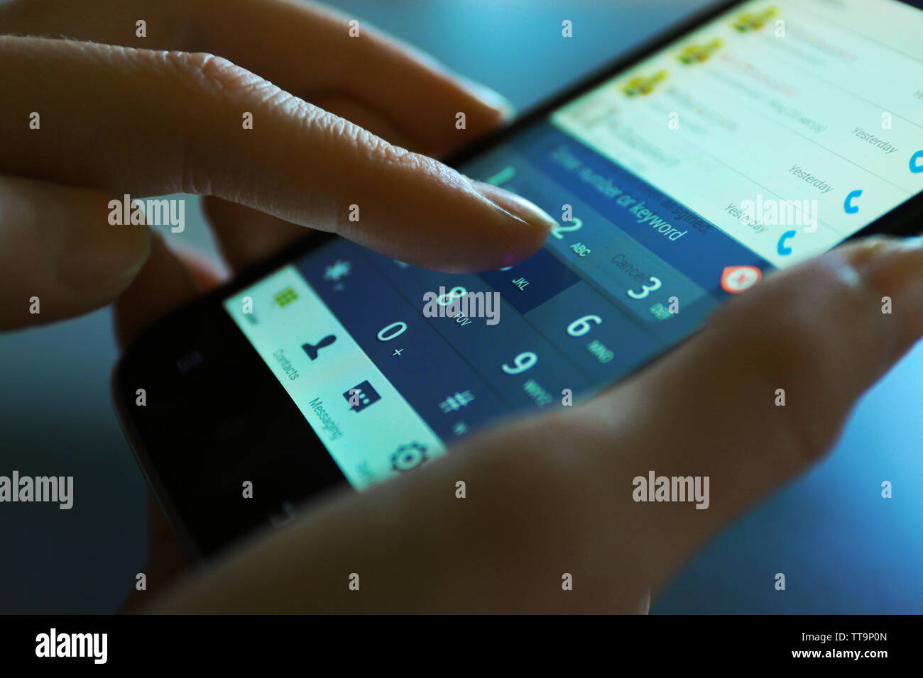 Finger touch number on smartphone to make a call, close up Stock Photo ...