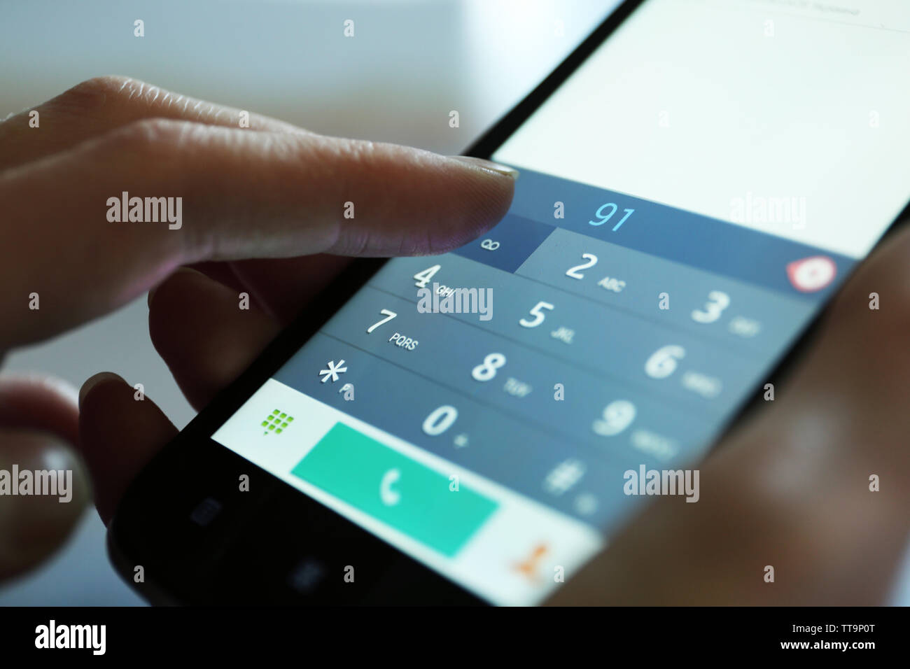 Finger touch number on smartphone to make a call, close up Stock Photo ...