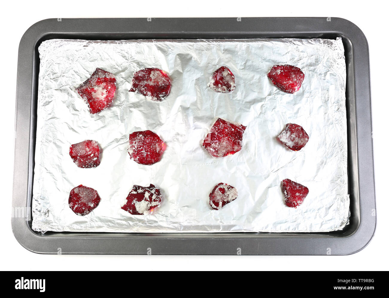 Candied sugared roses petals on tray, isolated on white Stock Photo - Alamy