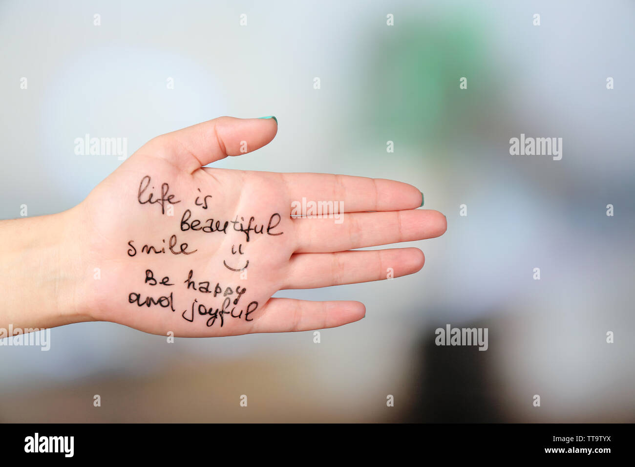 Female hand with written message on bright background Stock Photo - Alamy