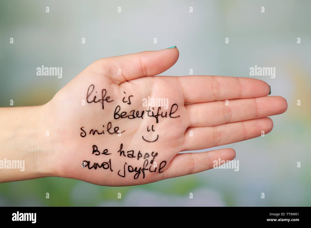 Female hand with written message on bright background Stock Photo - Alamy