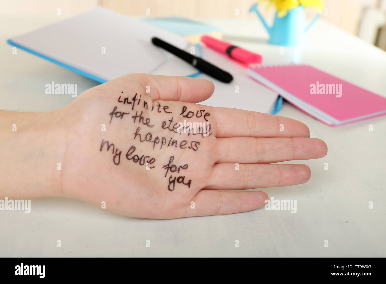 Female hand with written message on work place background Stock Photo ...