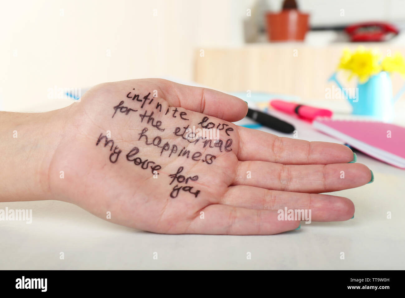 Female hand with written message on work place background Stock Photo ...