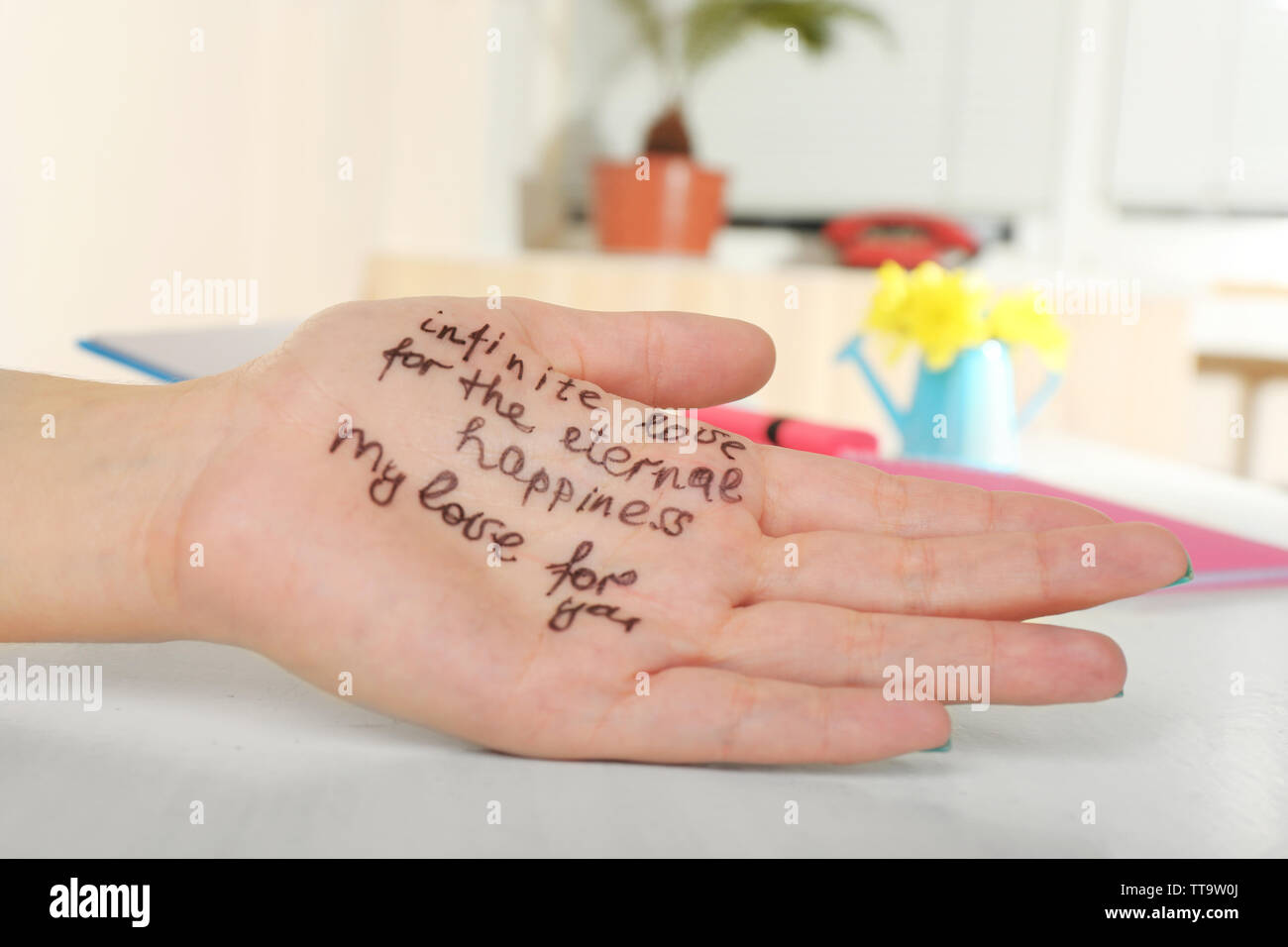 Female hand with written message on work place background Stock Photo ...