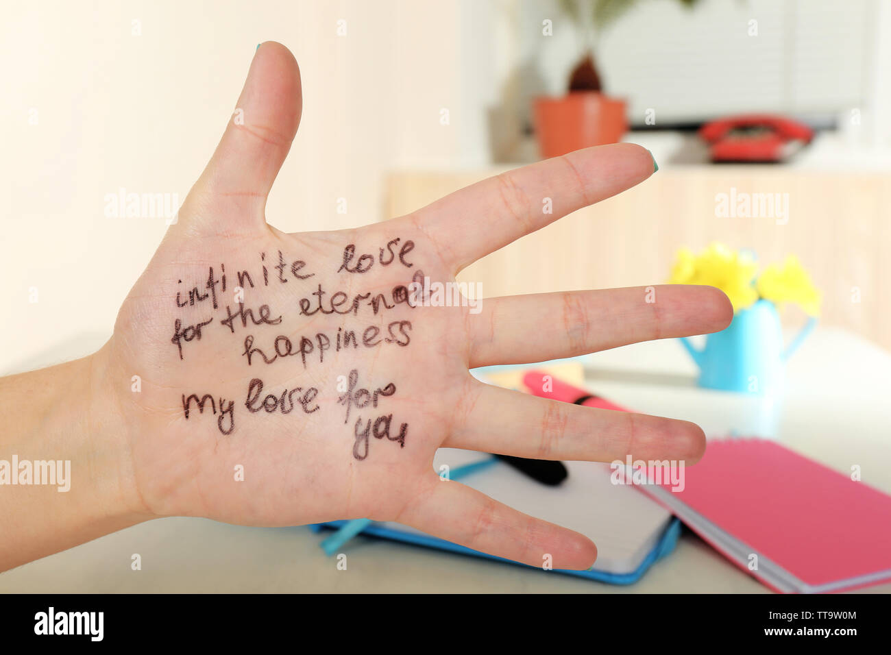 Female hand with written message on work place background Stock Photo ...