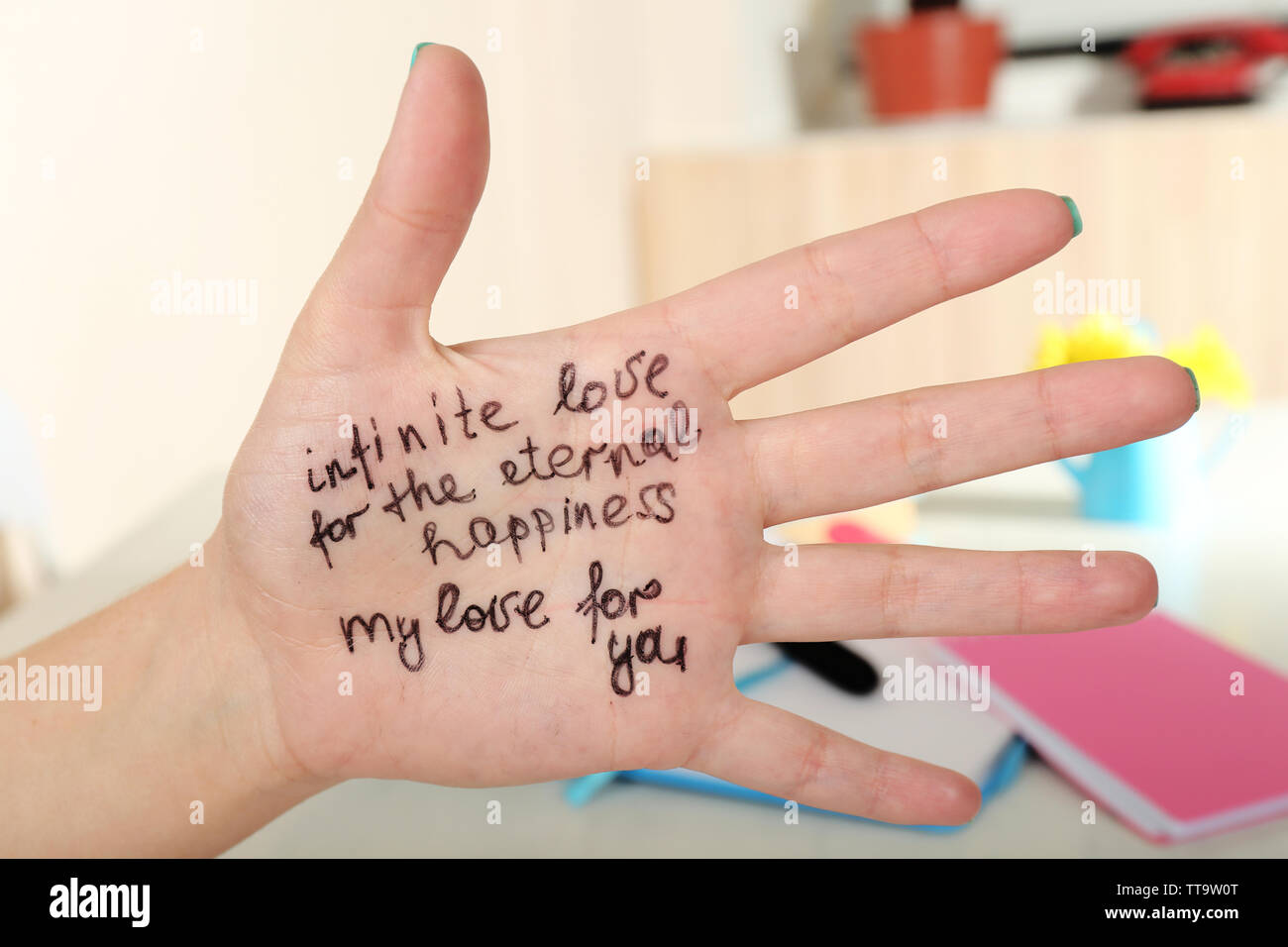 Female hand with written message on work place background Stock Photo ...