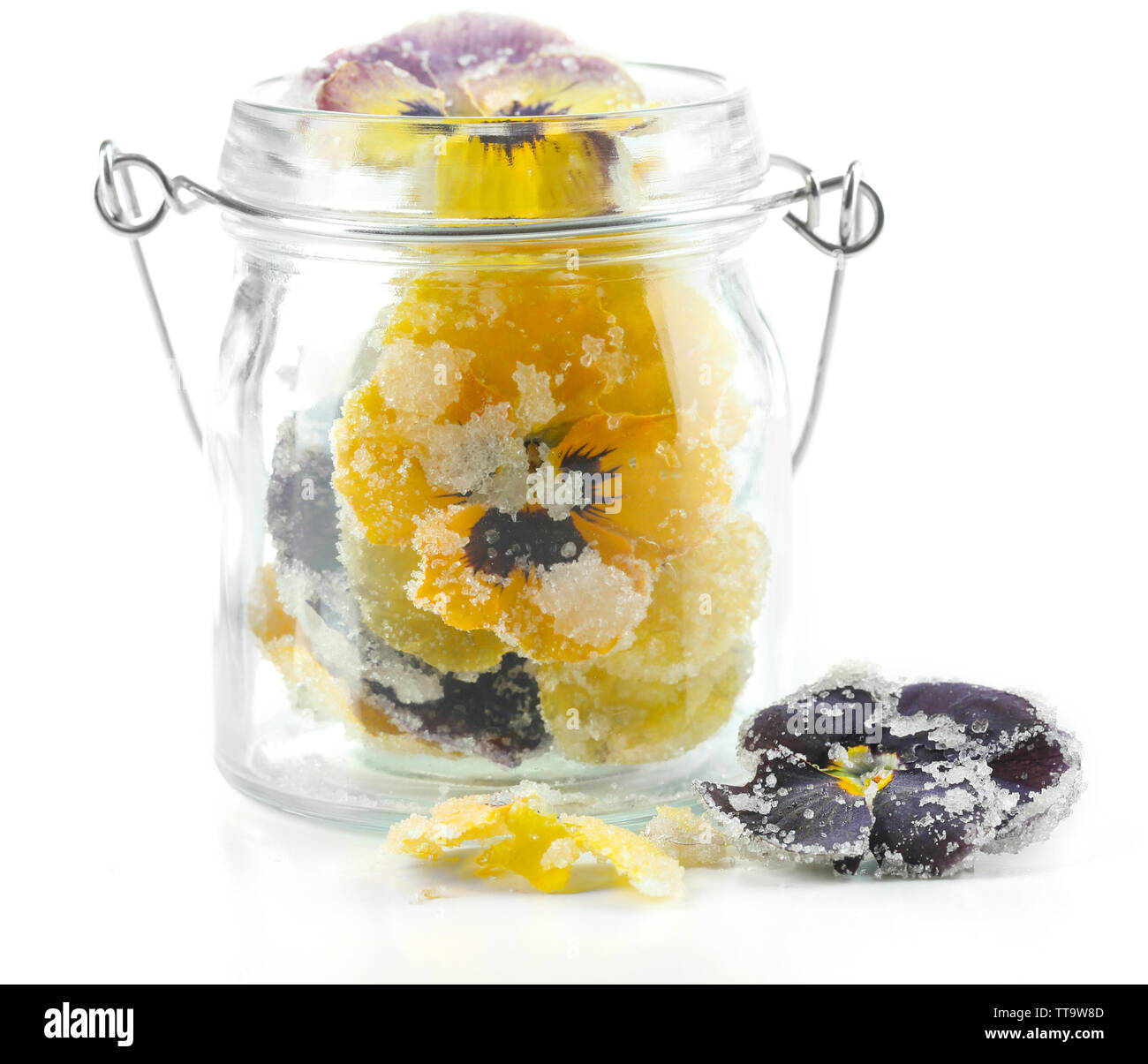 Candied sugared violet flowers in glass jar, isolated on white Stock ...