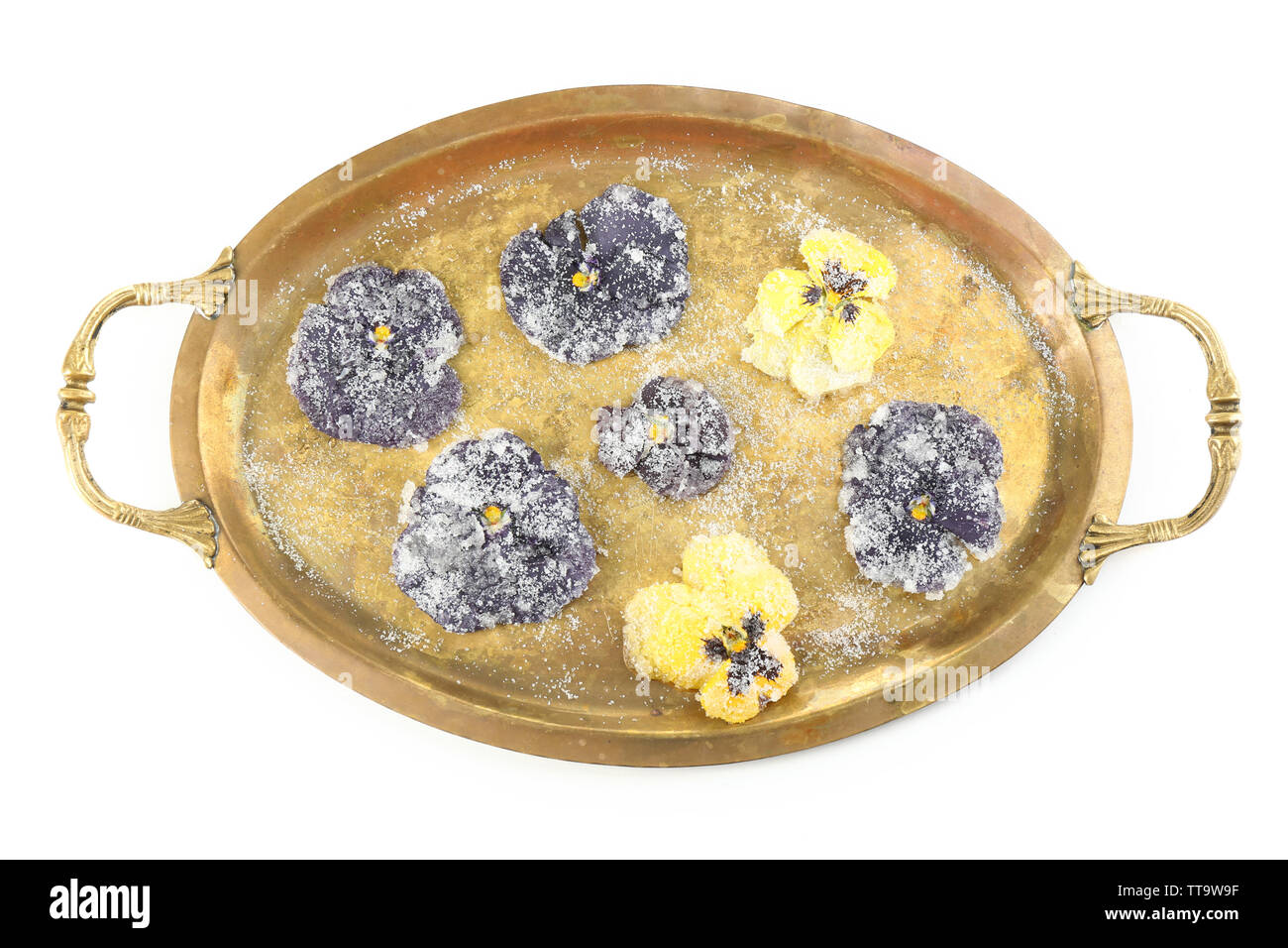 Candied sugared violet flowers on tray, isolated on white Stock Photo ...