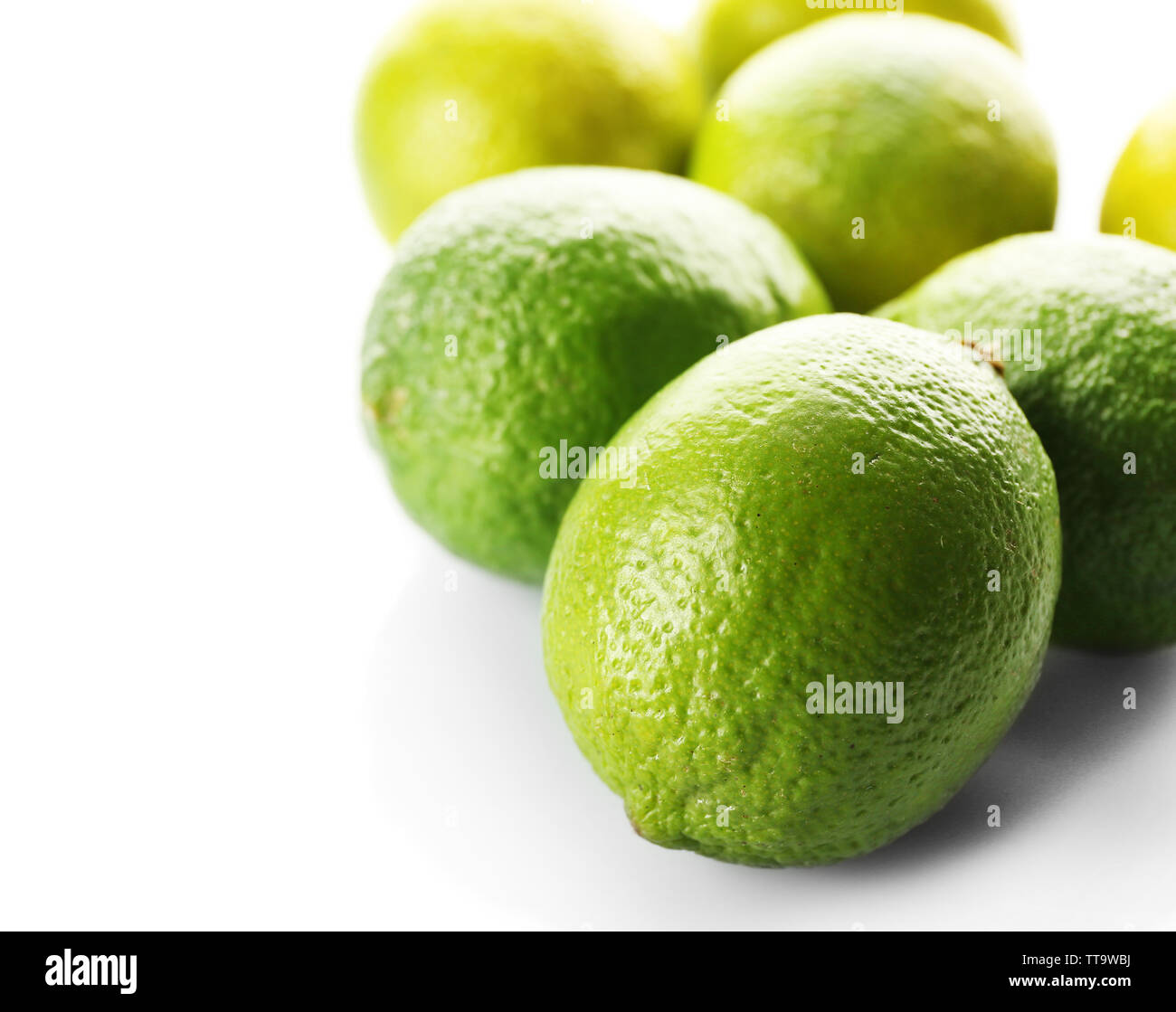 Group of fresh limes isolated on white Stock Photo - Alamy