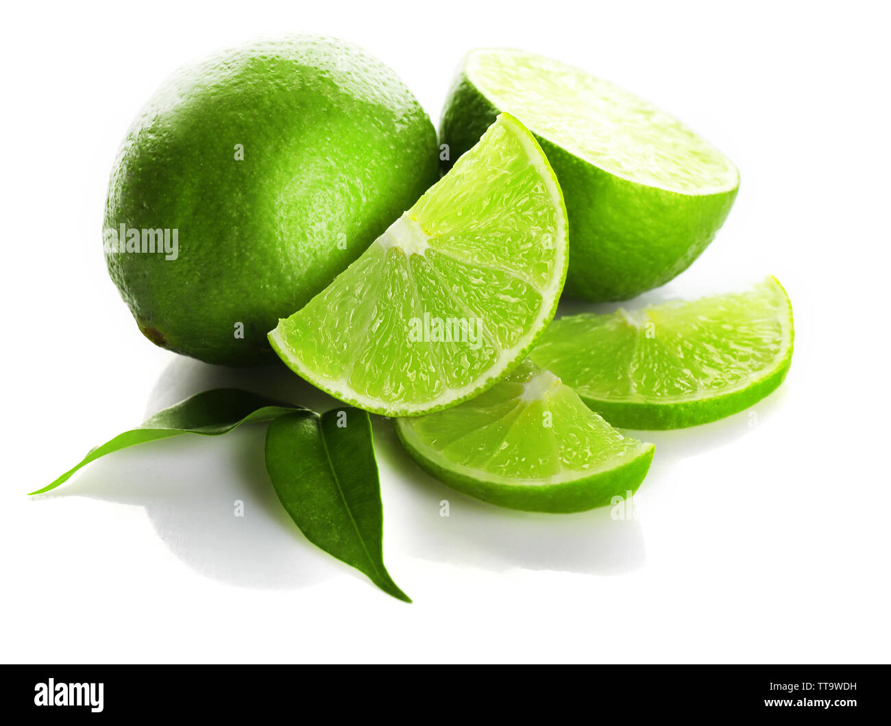 Sliced fresh limes isolated on white Stock Photo - Alamy