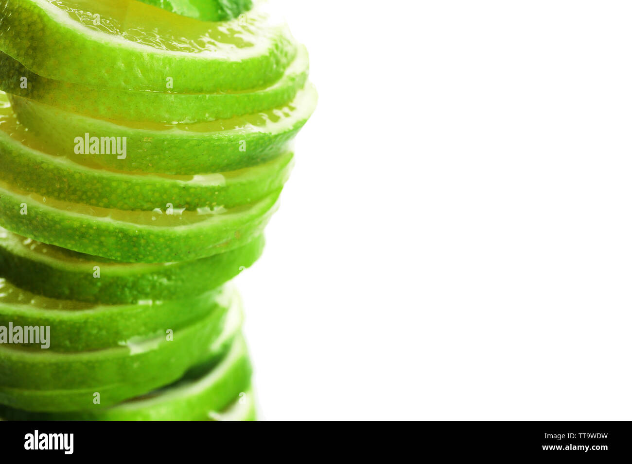 Stack of sliced fresh lime isolated on white Stock Photo - Alamy
