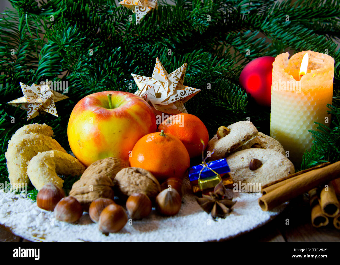 traditional german christmas sweets plate with fruits, nuts aqnd ...