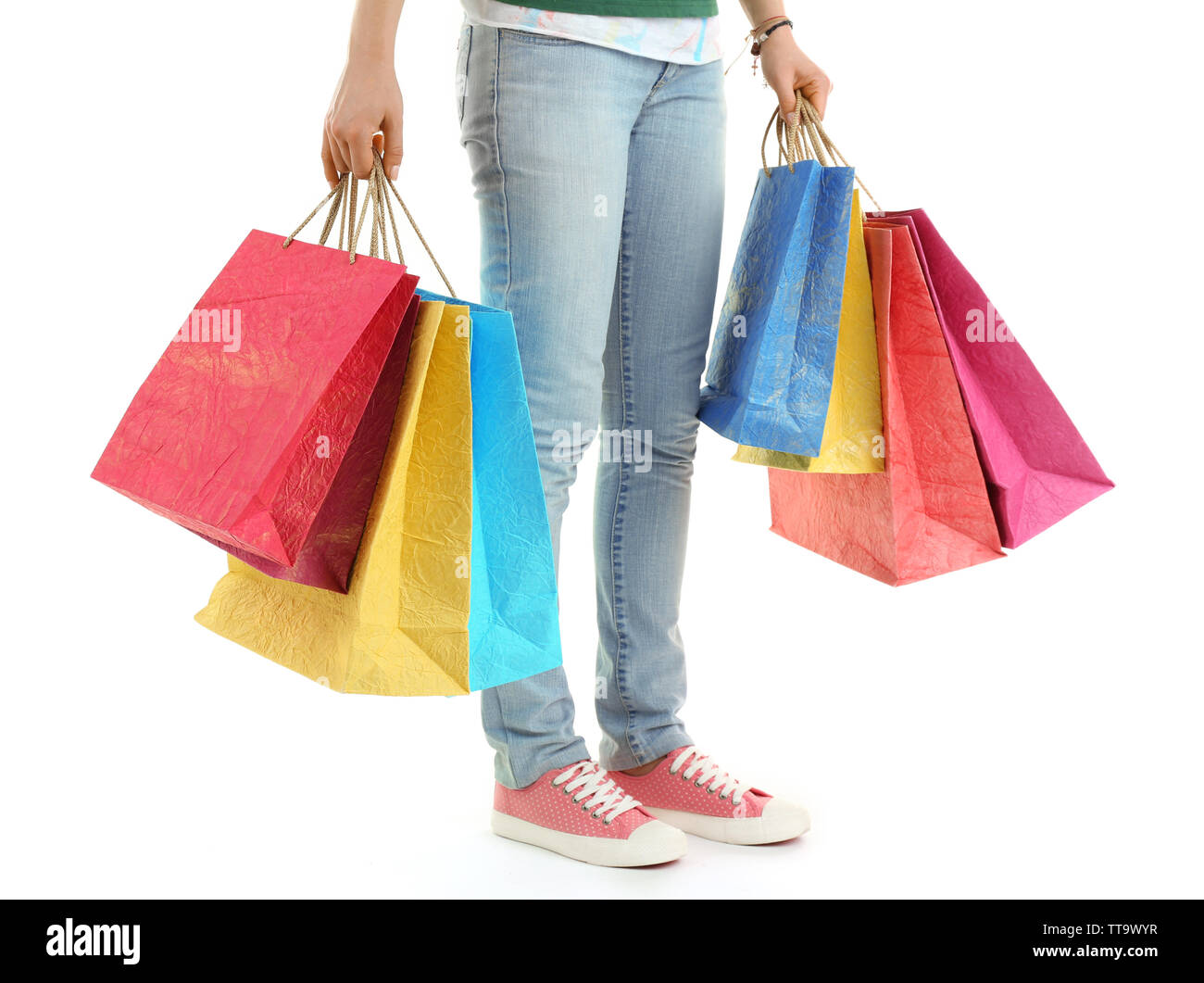 Colorful shopping paper bags in female hands isolated on white Stock ...