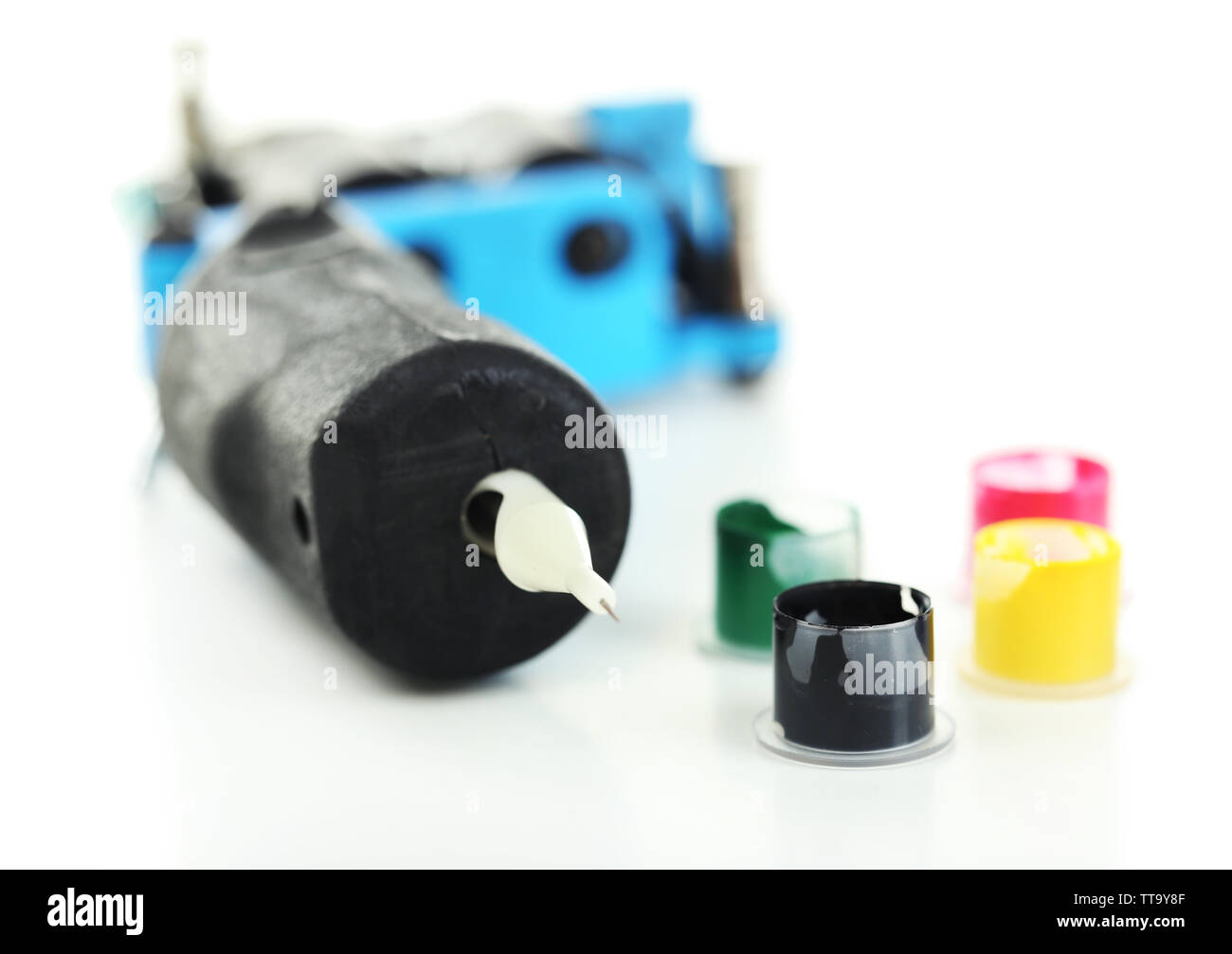 Tattoo machine with colorful ink isolated on white Stock Photo - Alamy