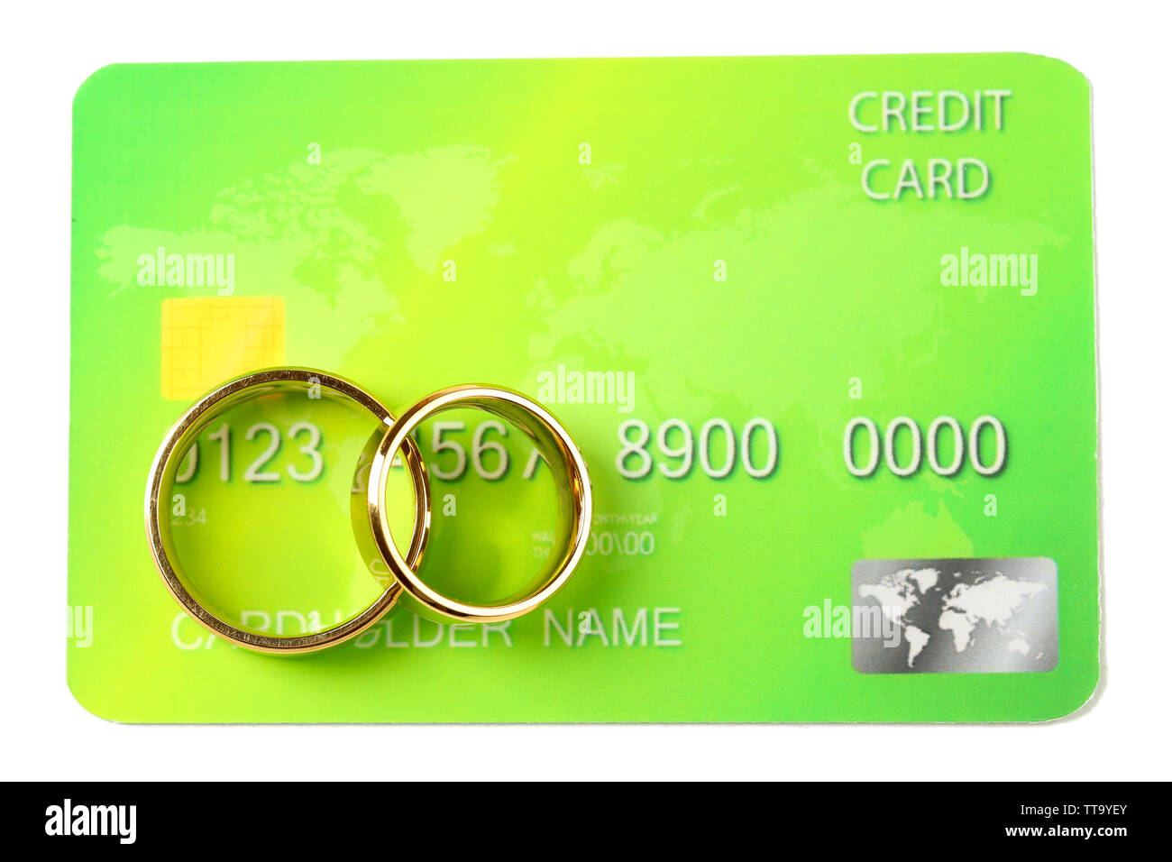 Golden wedding rings and credit card, isolated on white. Marriage of ...