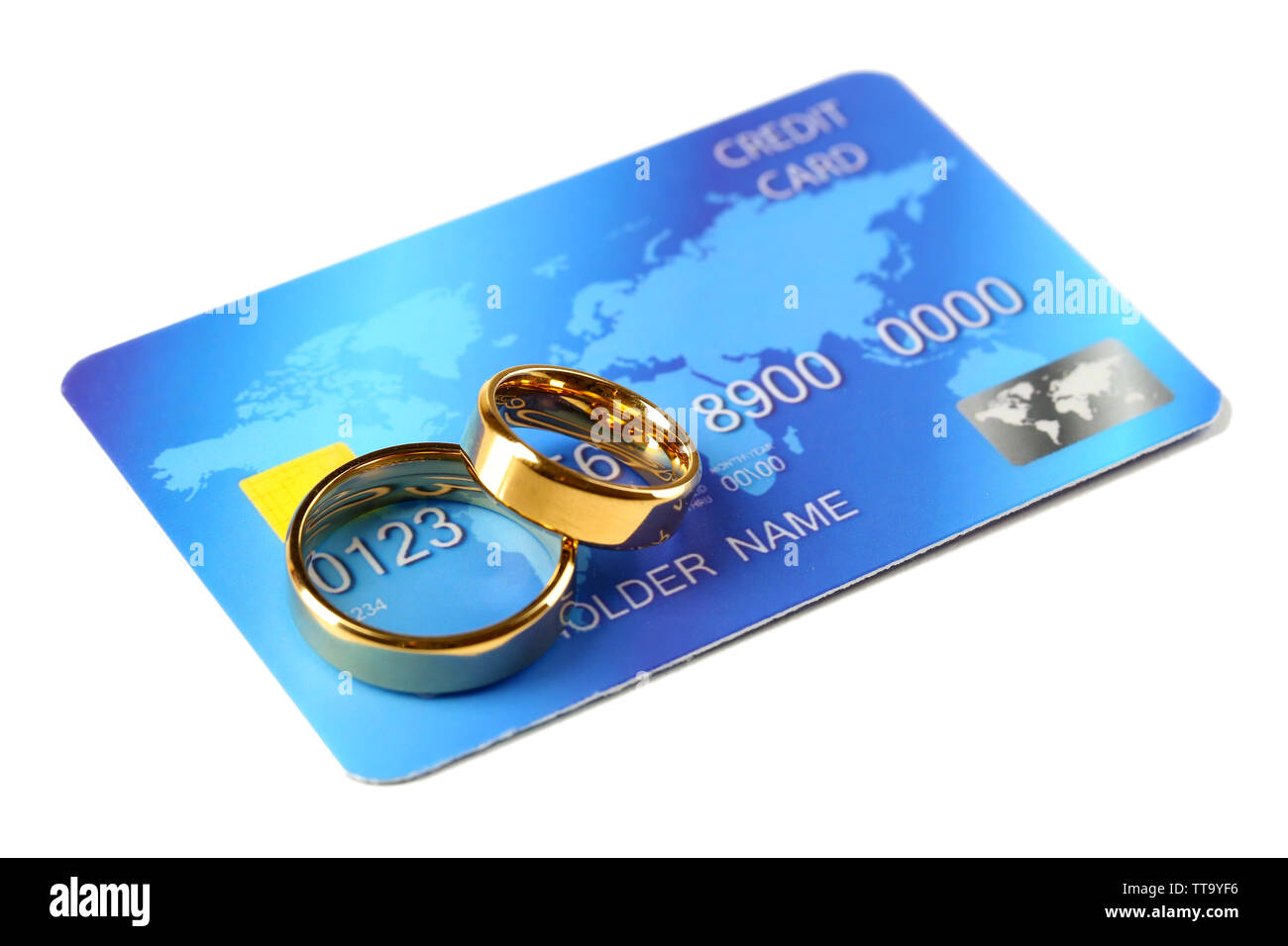 Golden wedding rings and credit card, isolated on white. Marriage of ...